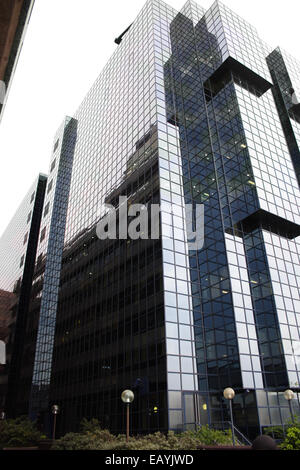 Glass and steel building near tower bridge at night Stock Photo - Alamy