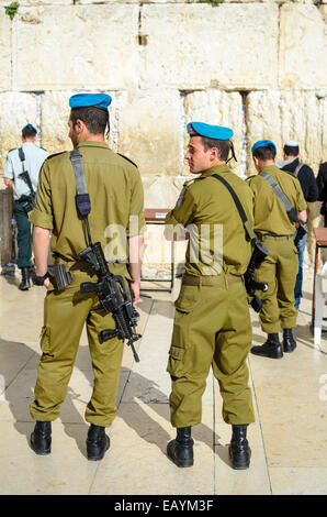 Israeli police and soldiers stand guard near the site of a shooting ...