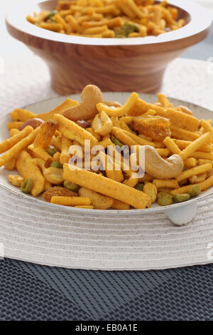 A spicy Indian snack of noodles nuts and peas called Bombay mix in the ...