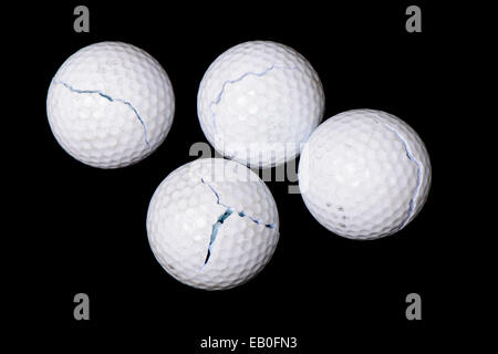 Golf balls isolated on black background Stock Photo - Alamy