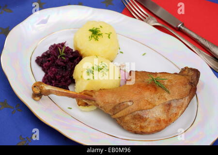 roasted goose leg with red cabbage and dumplings Stock Photo - Alamy