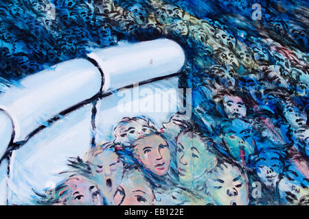 Graffiti tortured faces street art Berlin wall Stock Photo - Alamy