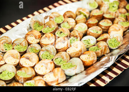 French cuisine - Escargot with butter sauce Stock Photo - Alamy