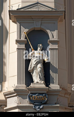 Statue of Veritas, the goddess of truth, on the baroque facade of the ...