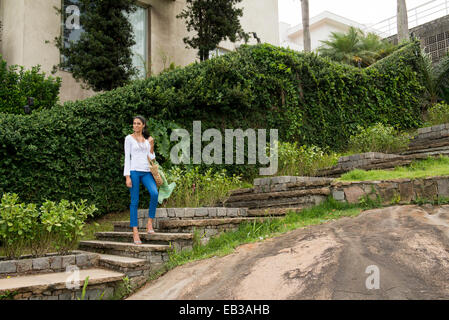 woman standing on stone steps Stock Photo - Alamy