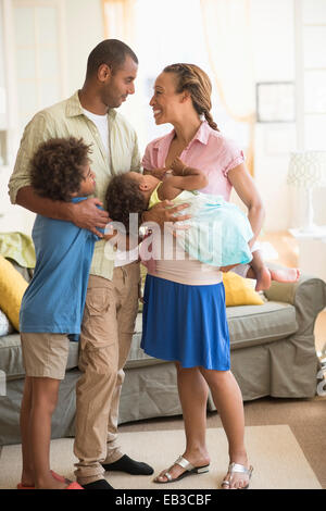 Smiling parents with children enjoying in autumn Stock Photo - Alamy