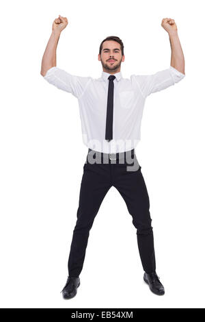 Smiling businessman lifting up something heavy on white background ...