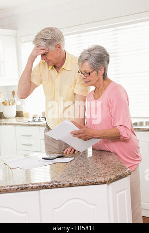 Stressed senior couple in debt at home Stock Photo - Alamy