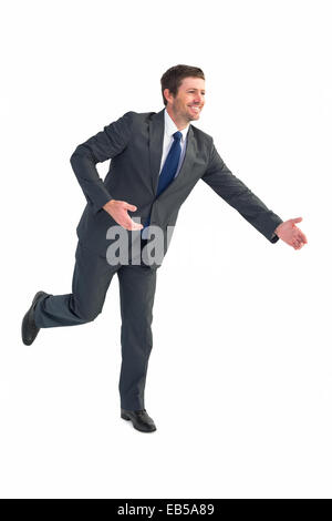 Businessman walking with his hands out Stock Photo - Alamy