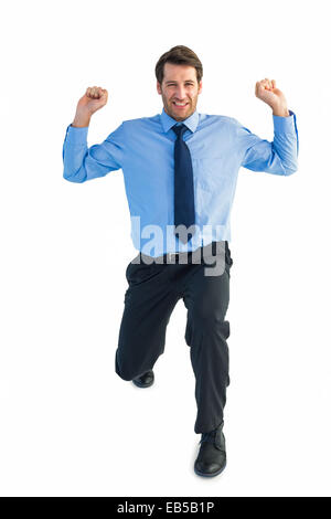 Focused businessman lifting up something heavy on white background ...
