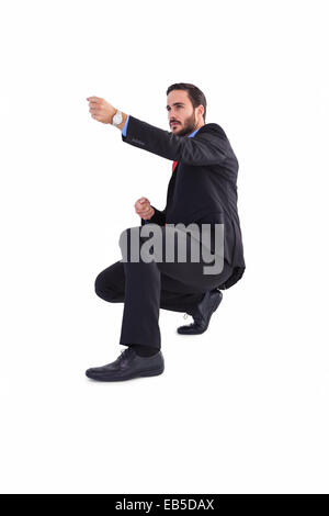 Business man pulling something isolated on white background Stock Photo ...