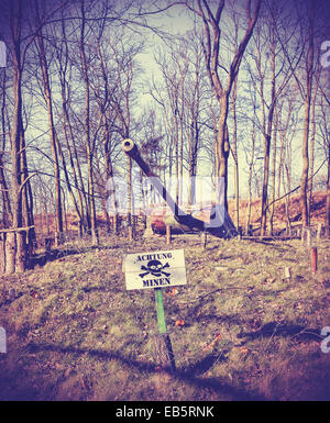 German land mines warning sign from World War Two, wet with water ...