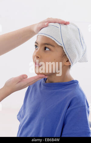 Bandage head child Stock Photo - Alamy