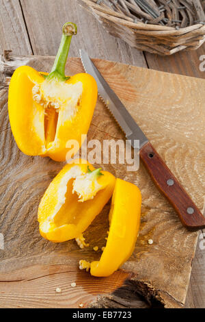 Food preparation - cut yellow bell pepper on kitchen table Stock Photo ...