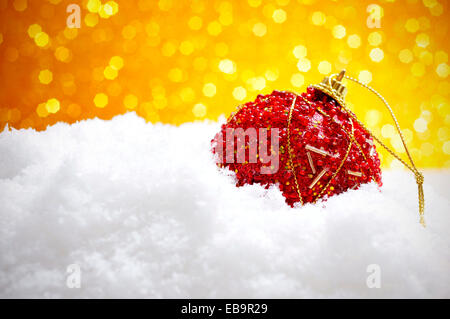 an ornamented golden christmas ball on the sand of a beach Stock Photo ...