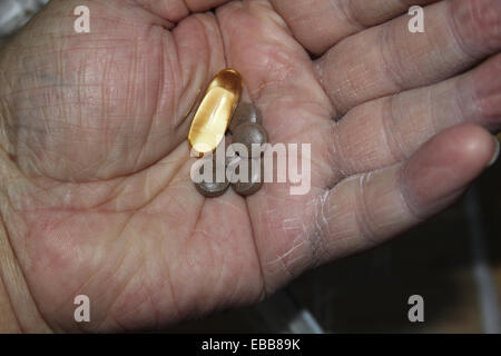tablets being held in the palm of the hand Stock Photo - Alamy