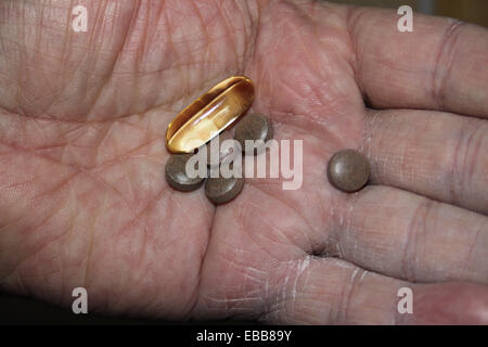 tablets being held in the palm of the hand Stock Photo - Alamy