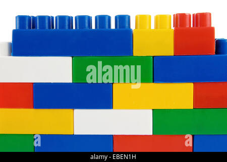 Colorful plastic bricks wall on white background Stock Photo - Alamy