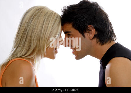young couple going into a huddle Stock Photo - Alamy