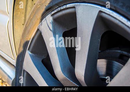 Silver car with rear part damaged in crash accident or collision with ...