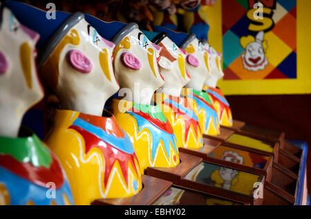 Fun fair clowns at side show alley Stock Photo - Alamy