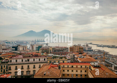 Morning view of Mount Vesuvius over Naples rooftops, dome and spires ...