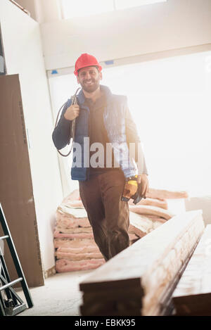 Smiling construction worker Stock Photo - Alamy