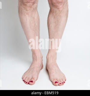 feet of a hairy man with his nails painted in LGBTIQ colours. bare feet ...