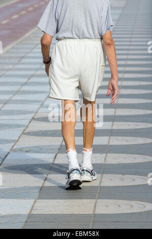 Fit senior man exercising in a park Stock Photo - Alamy