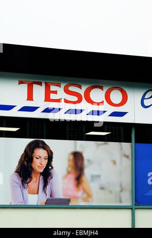 Tesco Express promotional window advertising England uk Stock Photo - Alamy