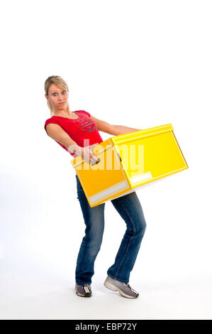 Woman carrying heavy boxes Stock Photo - Alamy