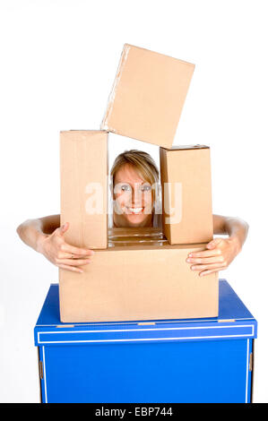 Blond woman looking at the view through the window Stock Photo - Alamy