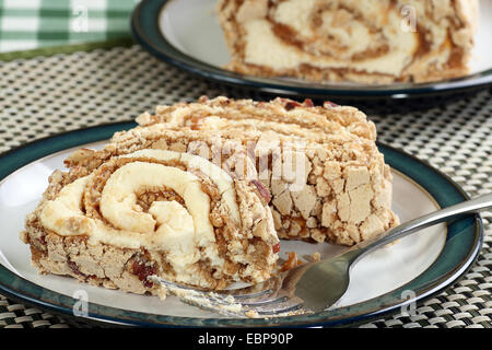 Toffee pecan roulade. Meringue, cream, toffee and pecan nuts dessert ...
