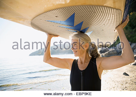 Smiling woman holding paddle Stock Photo: 57230740 - Alamy
