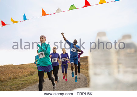 runners approaching the finish line of a race Stock Photo - Alamy