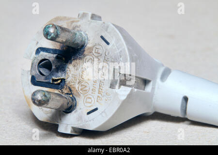 Burnt electrical plug Stock Photo - Alamy