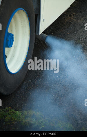 exhaust pipe emitting smoke and fumes from an old maritime diesel ...