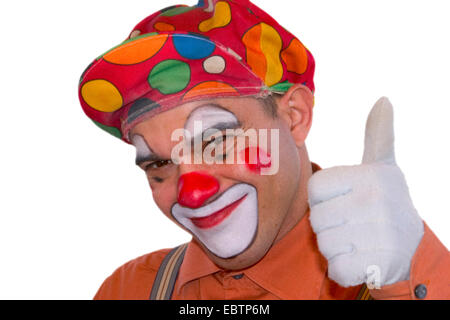 Cheerful funny clown showing a thumb up sign isolated on white ...