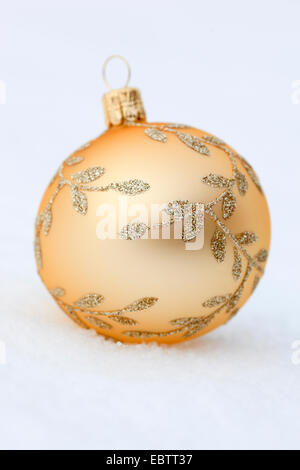 Christmas tree decorated with golden ball toys on a blurry, sparkling ...