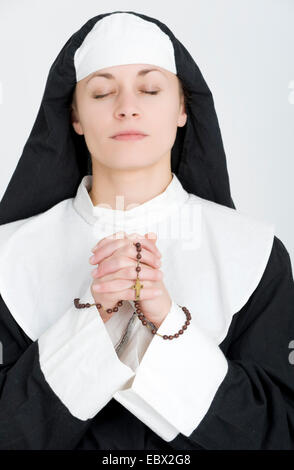 beautiful nun praying with closed eyes, isolated on white Stock Photo ...