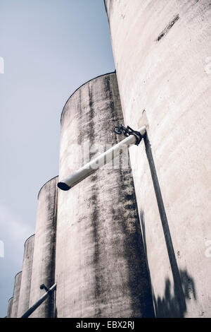 Low angle view of silo building against sky Stock Photo - Alamy