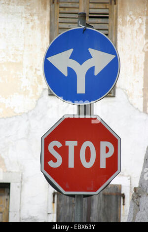 Stop sign and directional markers Stock Photo - Alamy