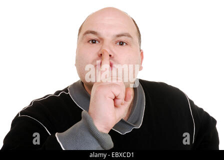 man shushing with hand gesture Stock Photo - Alamy