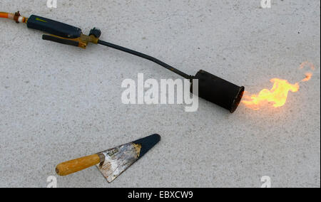 Laying roofing bitumen waterproofing with a gas burner When standing on ...