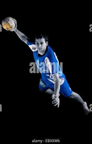 a handball in front of black background Stock Photo - Alamy