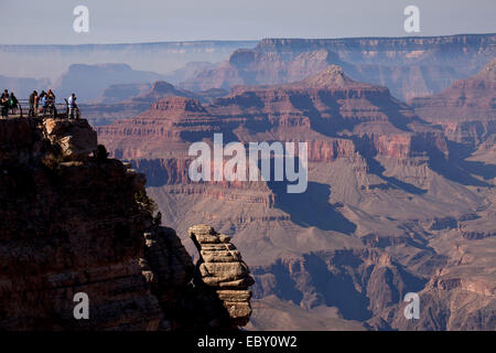 Tourists on Mather Point lookout, overlooking Isis Temple, Grand Canyon ...