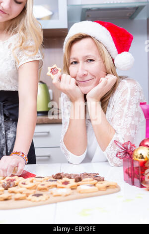 Woman making christmas cookies Stock Photo - Alamy