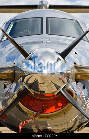 Small private turbo-propeller airplane in hangar, plane on inspection ...