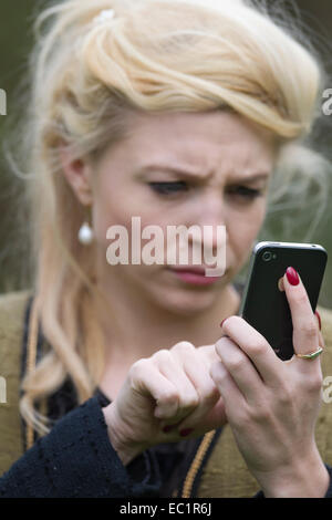 Women experiencing bad mobile phone connection outdoors Stock Photo - Alamy