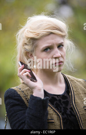 Women experiencing bad mobile phone connection outdoors Stock Photo - Alamy